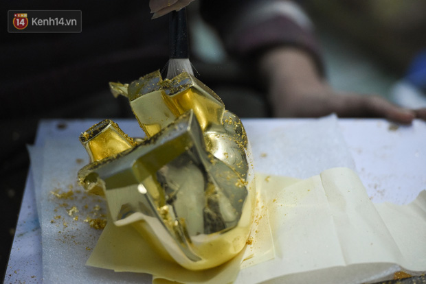 Close-up of the process of making a 24k gold-plated buffalo, priced at ...