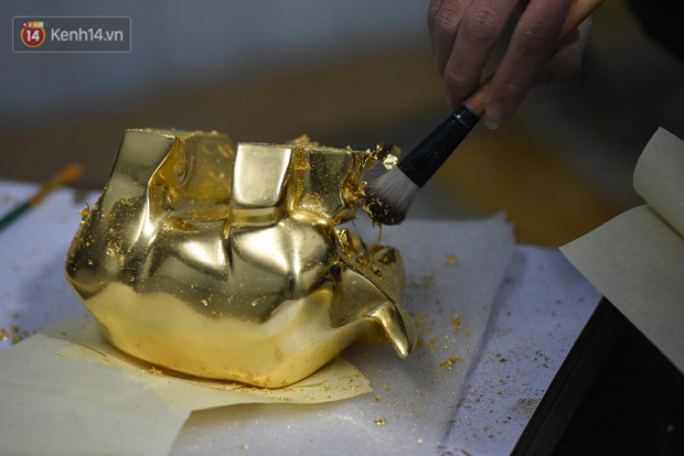 Close-up of the process of making a 24k gold-plated buffalo, priced at ...