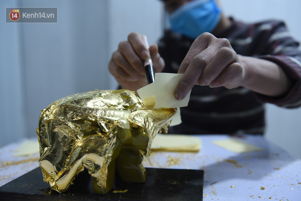 Close-up of the process of making a 24k gold-plated buffalo, priced at ...